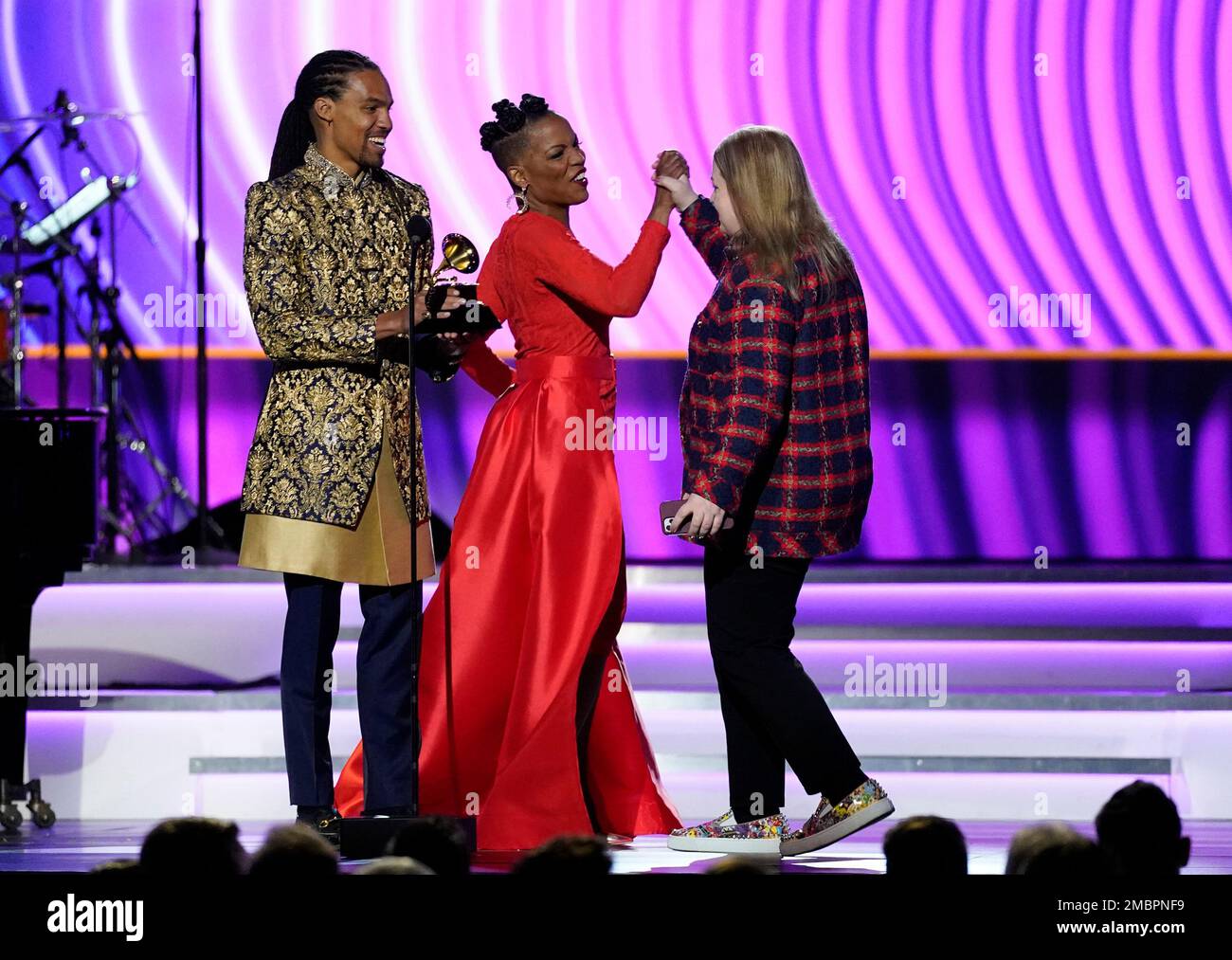 Pierce Freelon, from left, and Nnenna Freelon present the award for ...