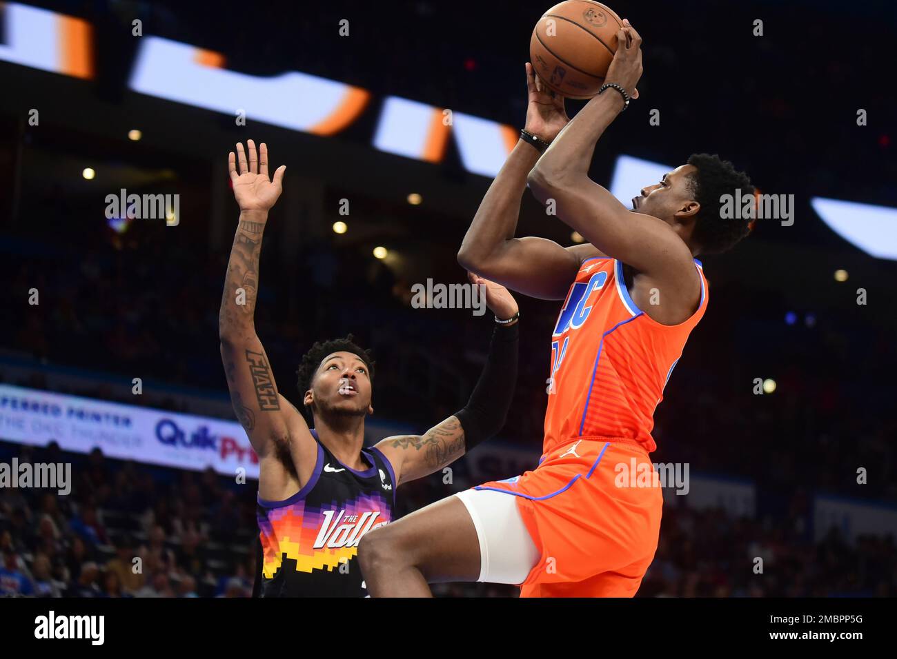 Oklahoma City Thunder forward Jaylen Hoard, right, shoots as Phoenix ...