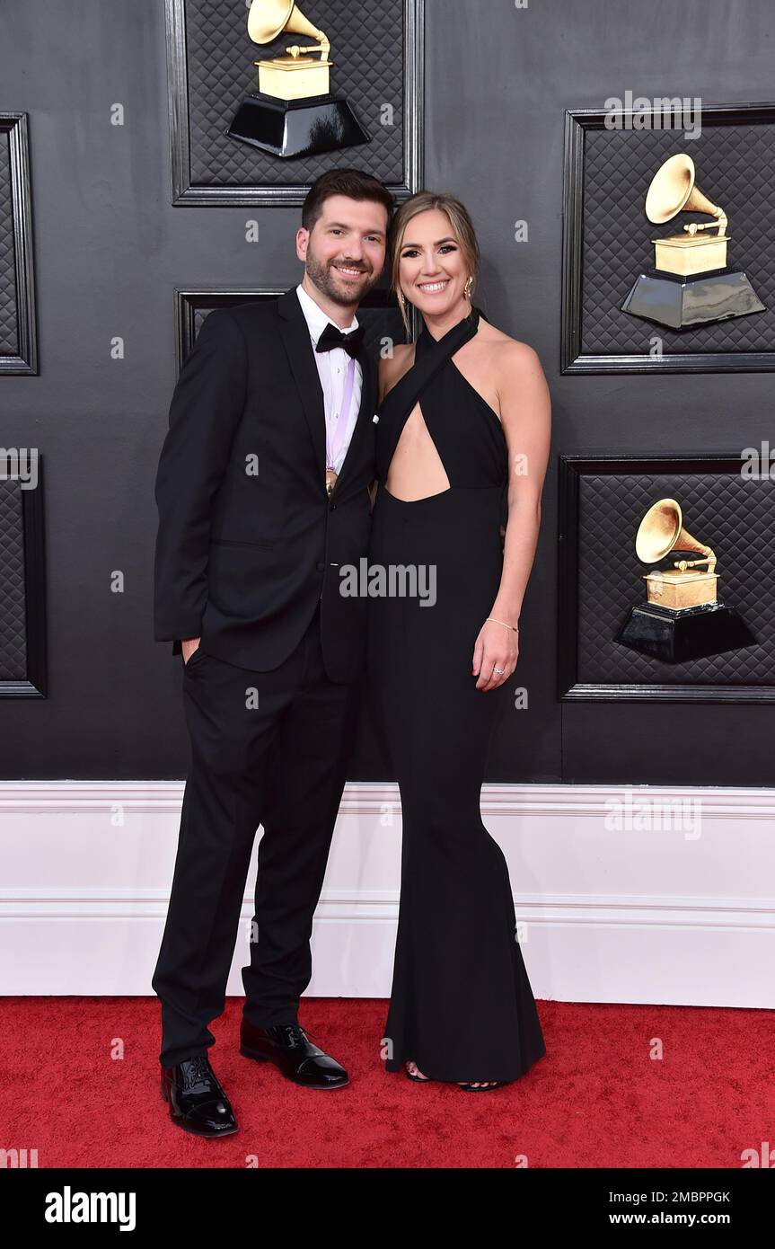 Zack Djurich, left, and Haley Killam arrive at the 64th Annual Grammy ...