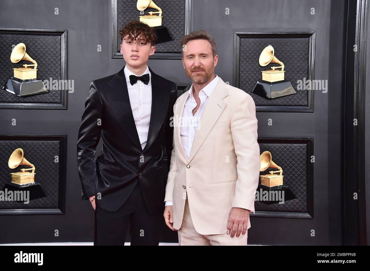Elvis Guetta, left, and David Guetta arrive at the 64th Annual Grammy ...
