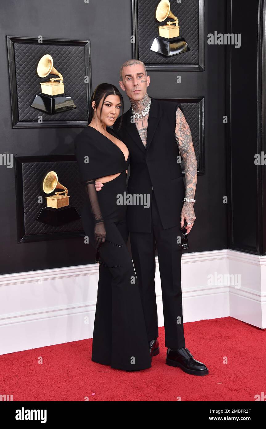 Kourtney Kardashian, left, and Travis Barker arrive at the 64th Annual ...