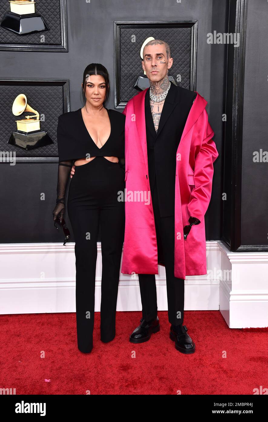 Kourtney Kardashian, left, and Travis Barker arrive at the 64th Annual ...
