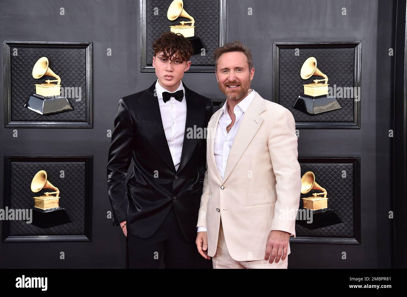 Elvis Guetta, left, and David Guetta arrive at the 64th Annual Grammy ...