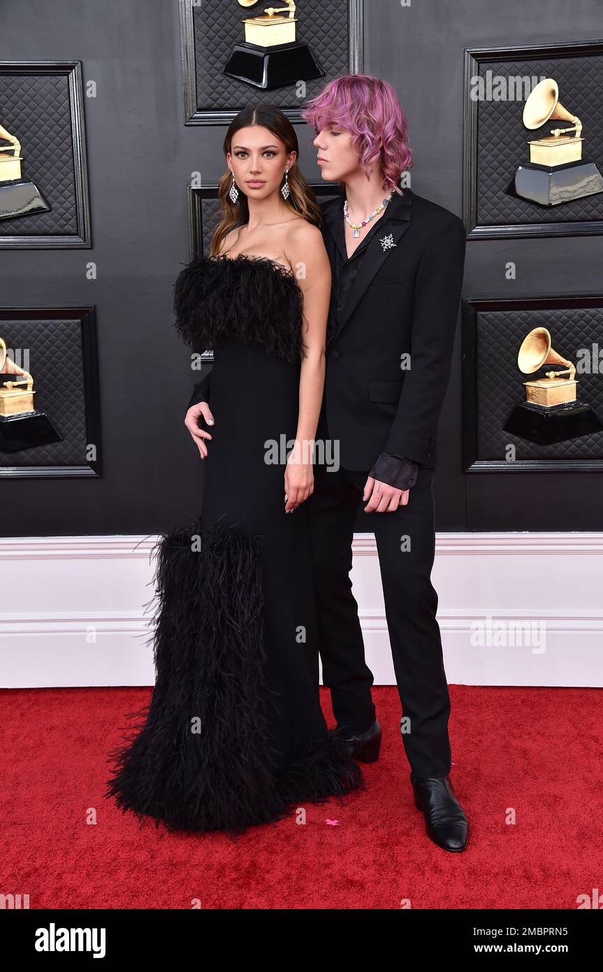 Katarina Deme, left, and The Kid LAROI arrive at the 64th Annual Grammy ...