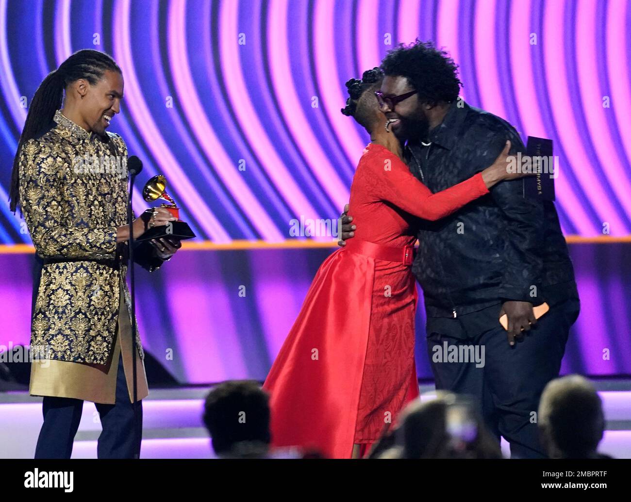 Pierce Freelon, from left, and Nnenna Freelon present the award for ...