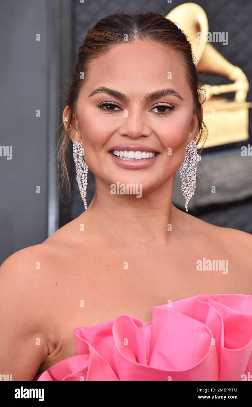 Chrissy Teigen arrives at the 64th Annual Grammy Awards at the MGM ...