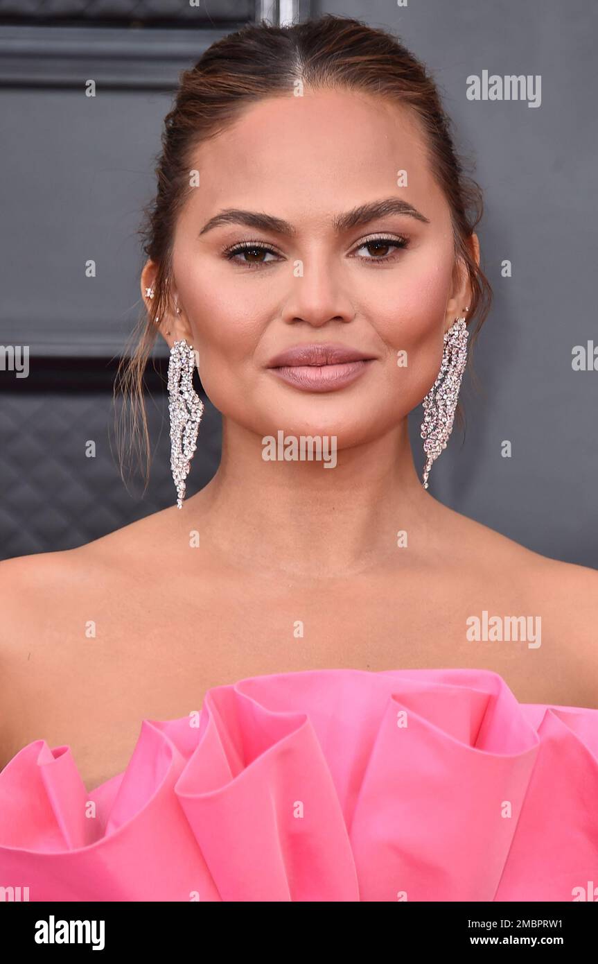 Chrissy Teigen arrives at the 64th Annual Grammy Awards at the MGM ...
