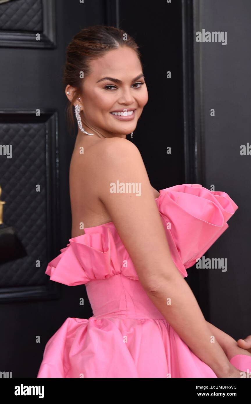 Chrissy Teigen arrives at the 64th Annual Grammy Awards at the MGM ...