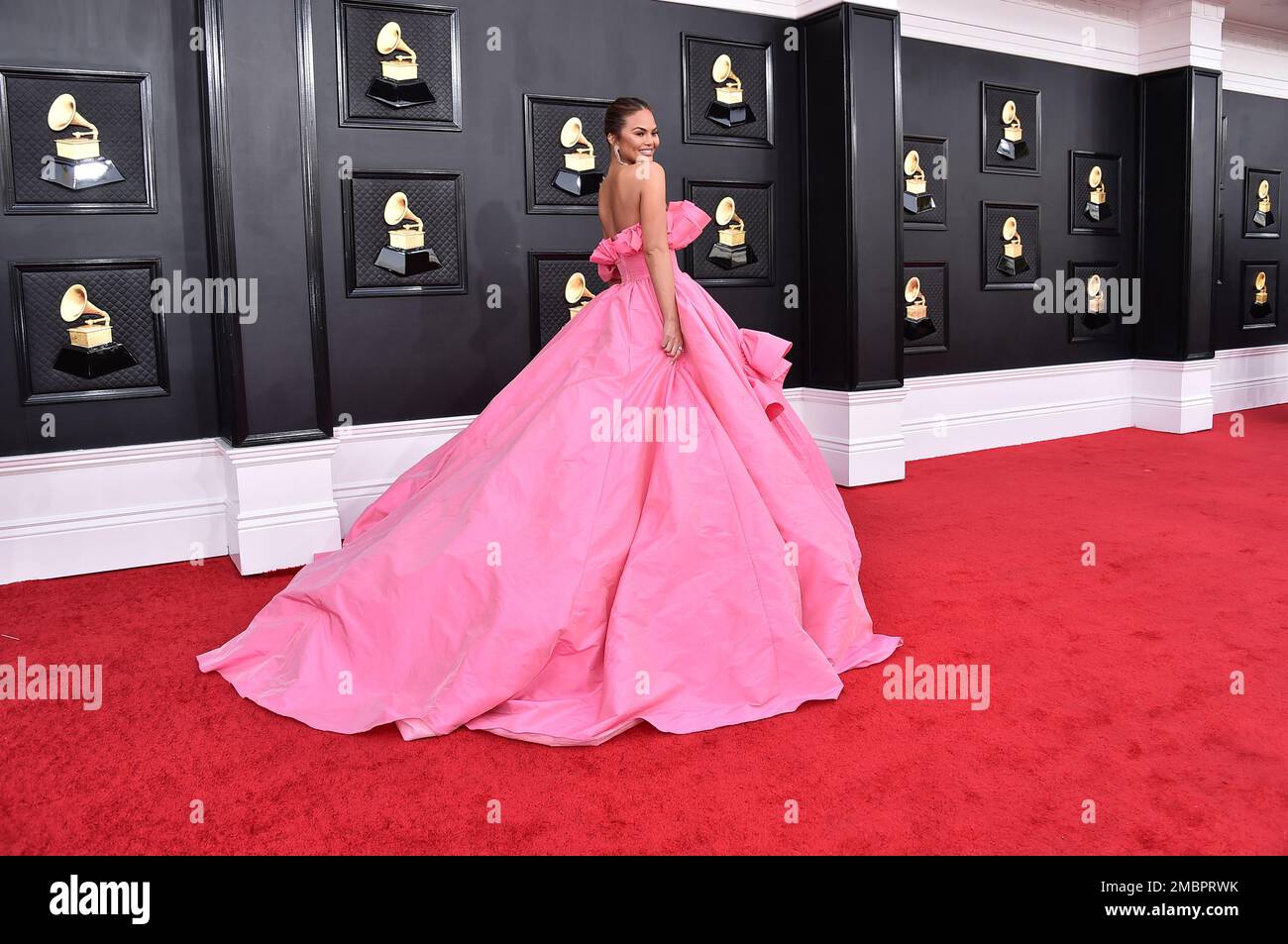 Chrissy Teigen arrives at the 64th Annual Grammy Awards at the MGM ...