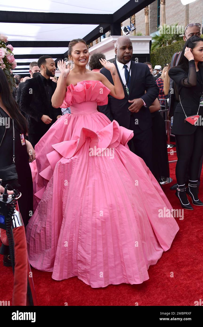 Chrissy Teigen arrives at the 64th Annual Grammy Awards at the MGM ...