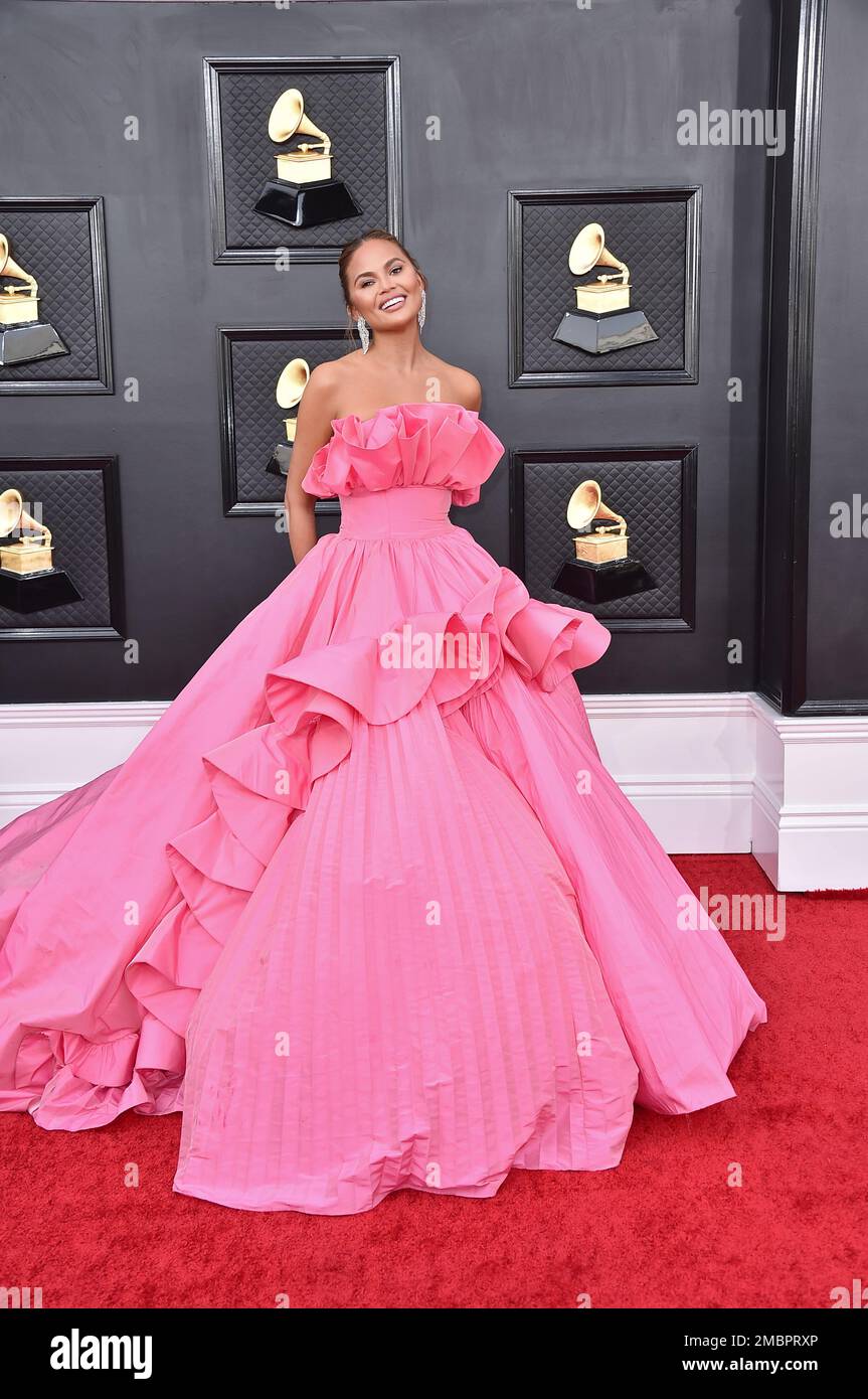 Chrissy Teigen arrives at the 64th Annual Grammy Awards at the MGM ...