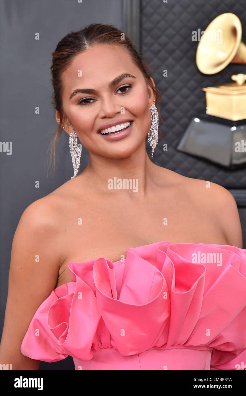 Chrissy Teigen arrives at the 64th Annual Grammy Awards at the MGM ...