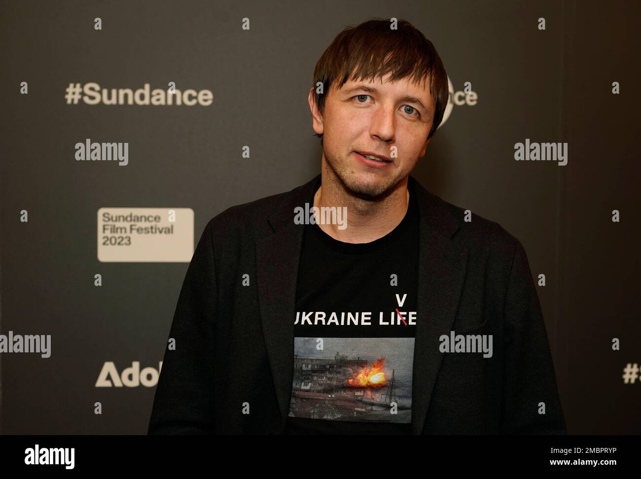 Associated Press photographer Evgeniy Maloletka poses at the world premiere of the documentary ...