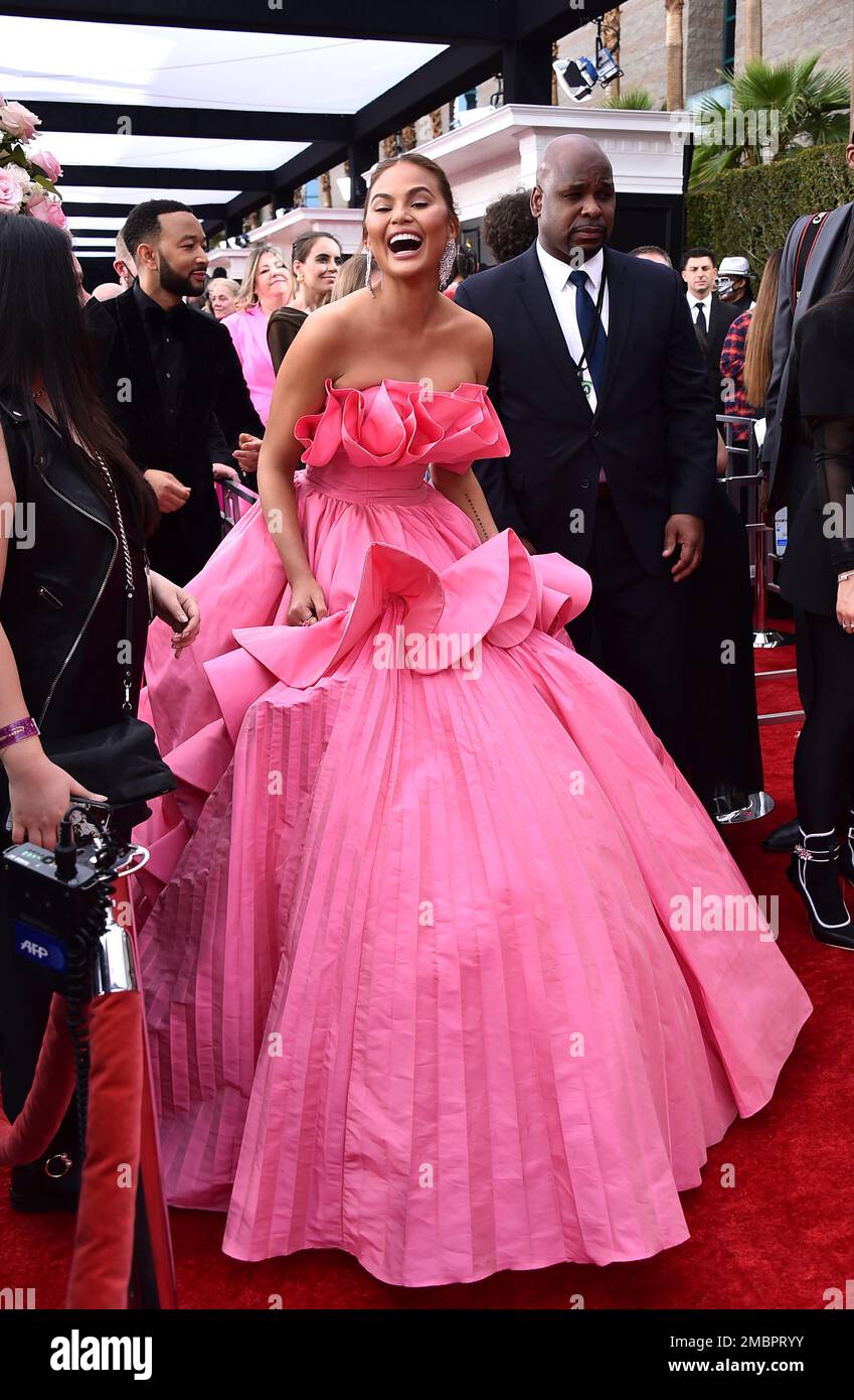 Chrissy Teigen arrives at the 64th Annual Grammy Awards at the MGM ...