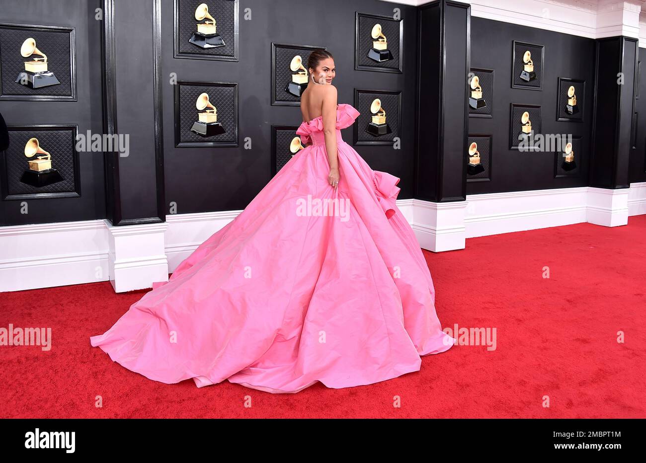 Chrissy Teigen arrives at the 64th Annual Grammy Awards at the MGM ...