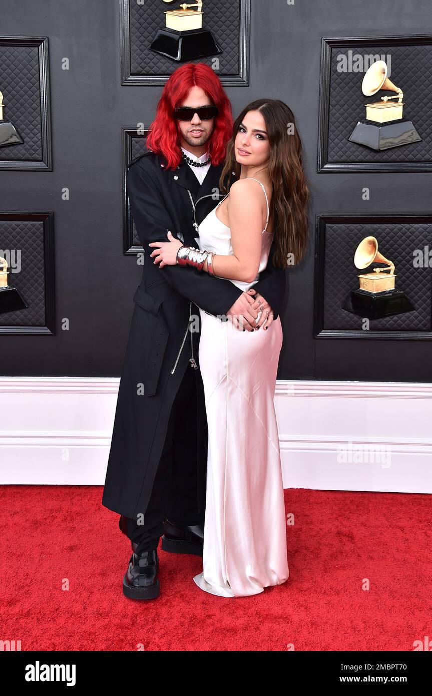 Omer Fedi, left, and Addison Rae arrive at the 64th Annual Grammy ...