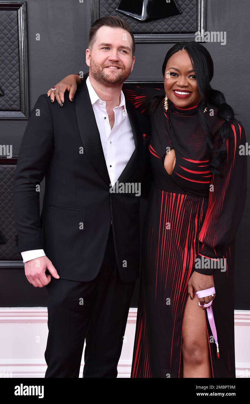 Sam Ashworth, left, and Ruby Amanfu arrive at the 64th Annual Grammy ...