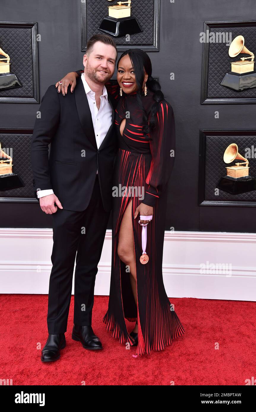Sam Ashworth, left, and Ruby Amanfu arrive at the 64th Annual Grammy ...