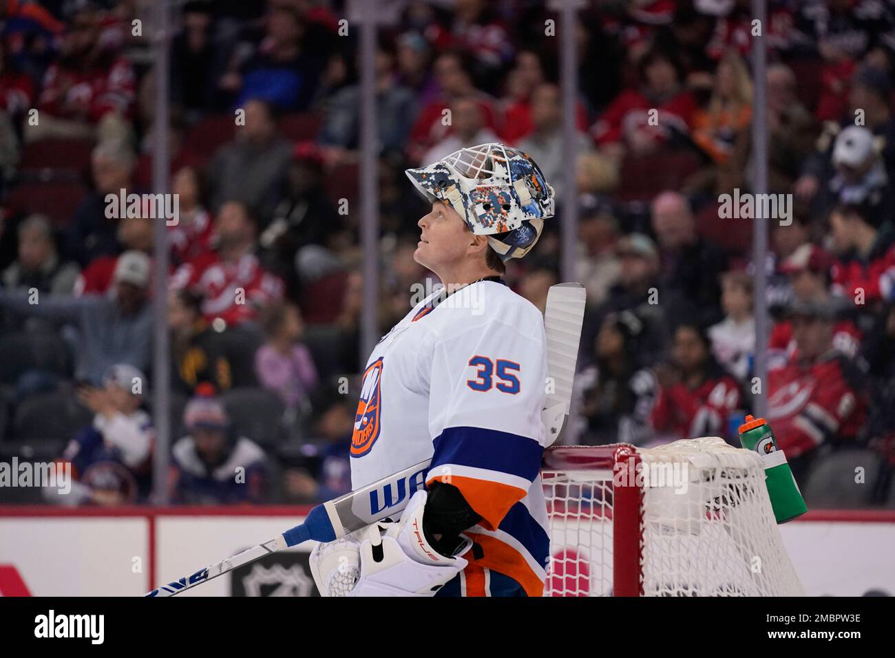 New York Islanders goaltender Cory Schneider looks up at the scoreboard ...