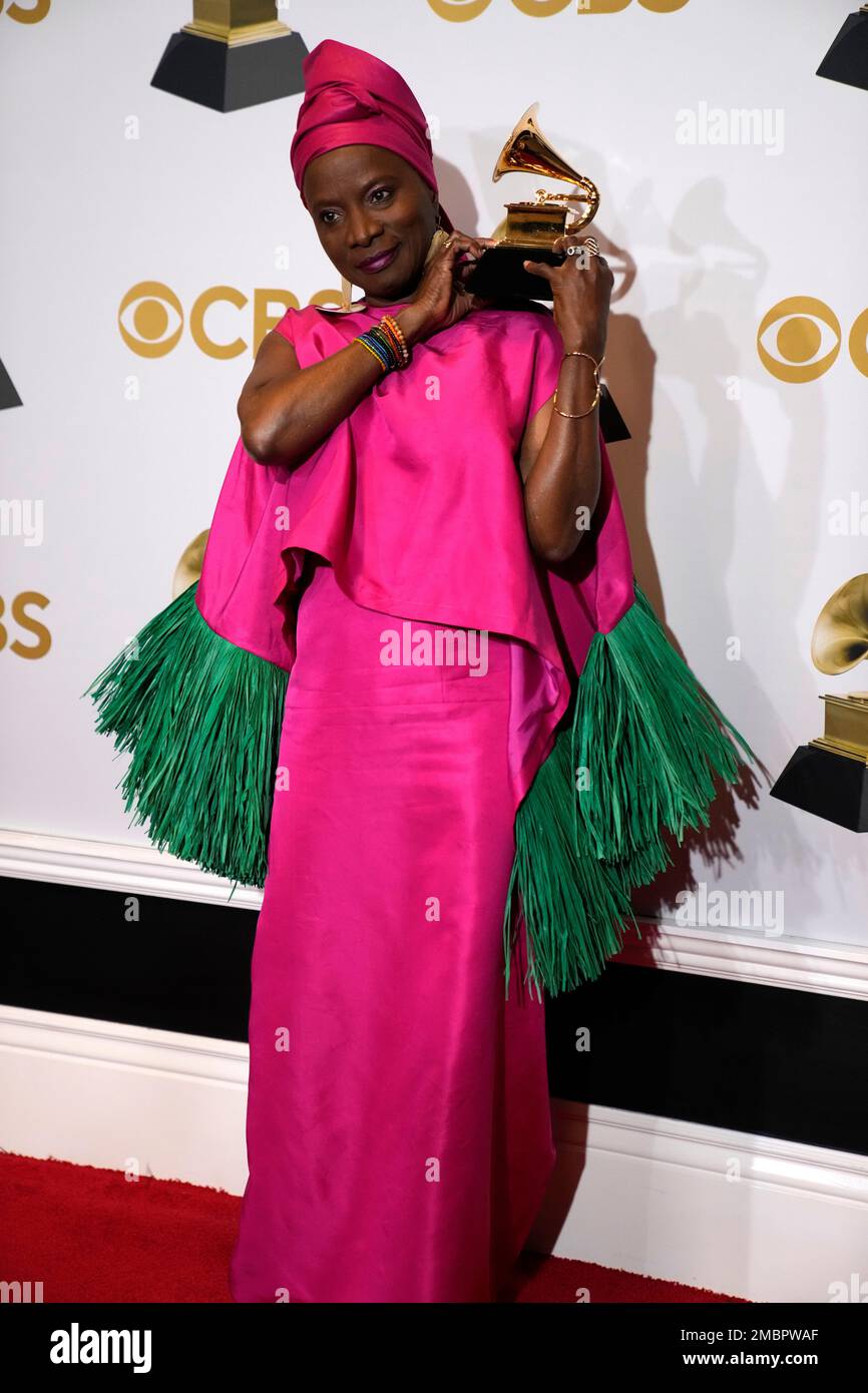Angelique Kidjo poses in the press room with the award for best global ...