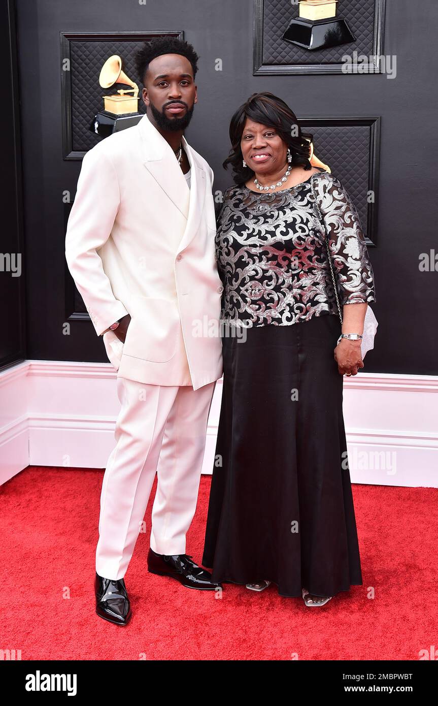 Dante Bowe, left, and Rosa White arrive at the 64th Annual Grammy ...