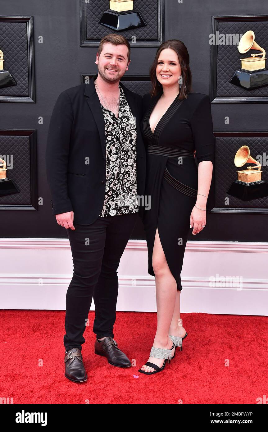 Jimmy Robbins, left, and Sarah Robbins arrive at the 64th Annual Grammy ...