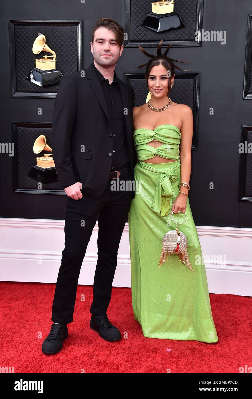 Jake Torrey, left, and Tia Tia arrive at the 64th Annual Grammy Awards ...