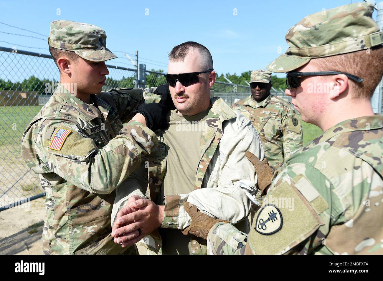 U.S. Army Reserve Spc. Joaquin Miranda, left, Corrections Officer ...