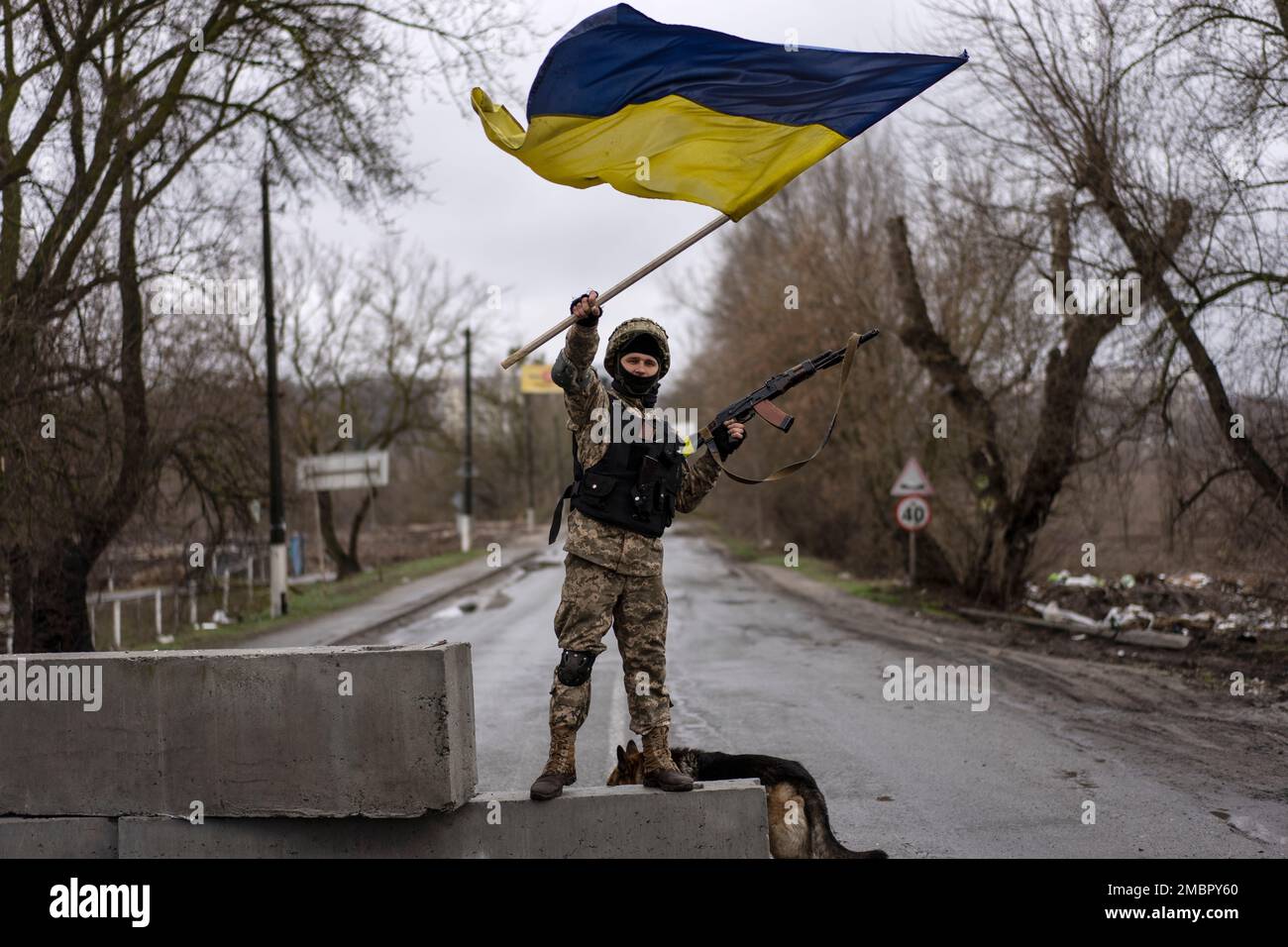A Ukrainian soldier celebrates in a check point in Bucha, in the ...