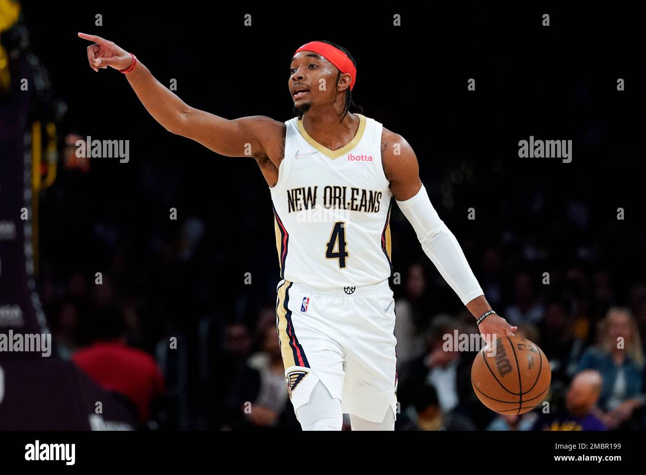 New Orleans Pelicans guard Devonte' Graham (4) controls the ball during ...