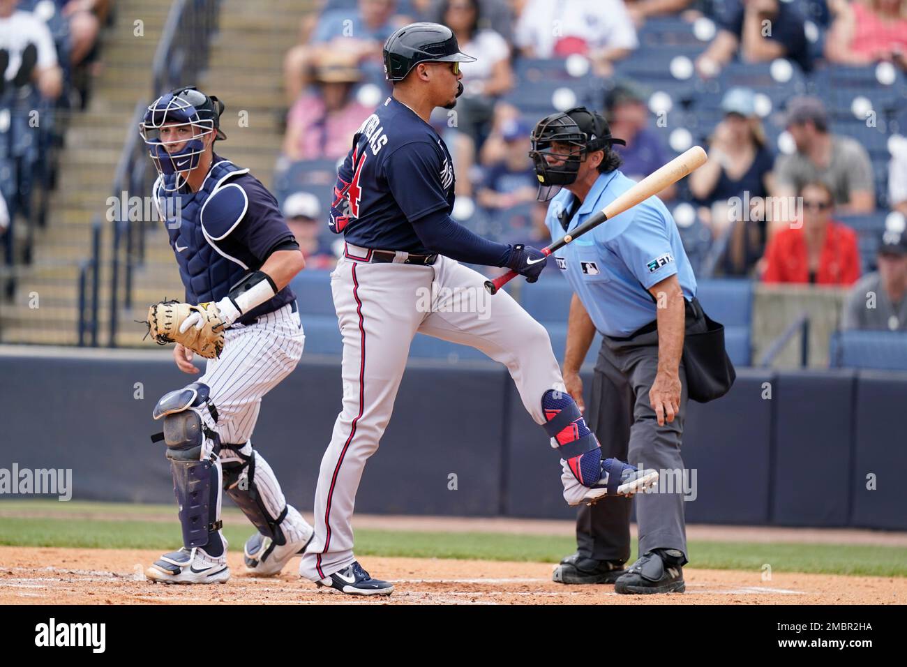 Atlanta Braves' William Contreras, center, moves away from the plate as ...