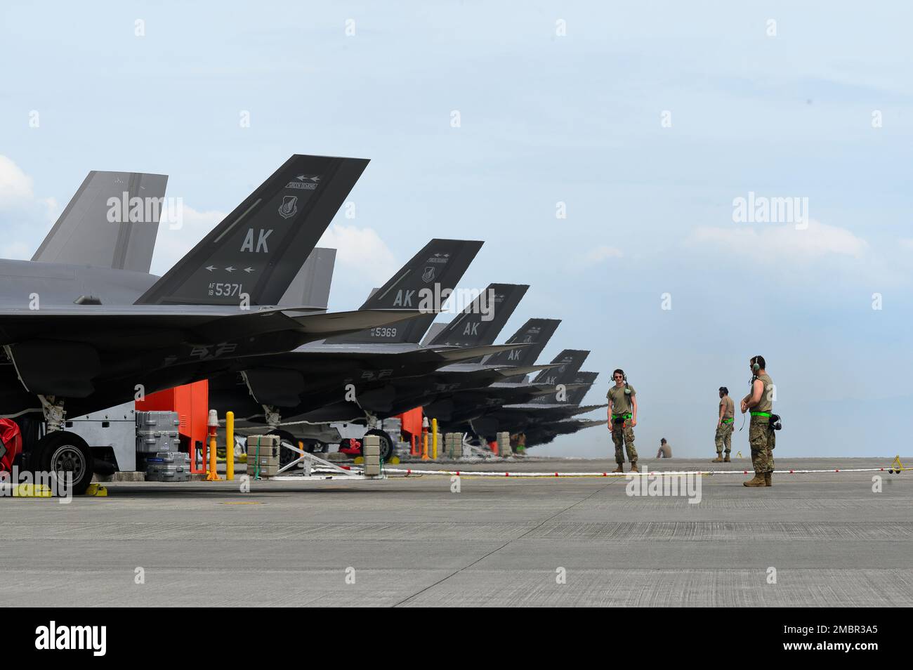 U.S. Airmen assigned to the 354th Air Expeditionary Wing stand by ...