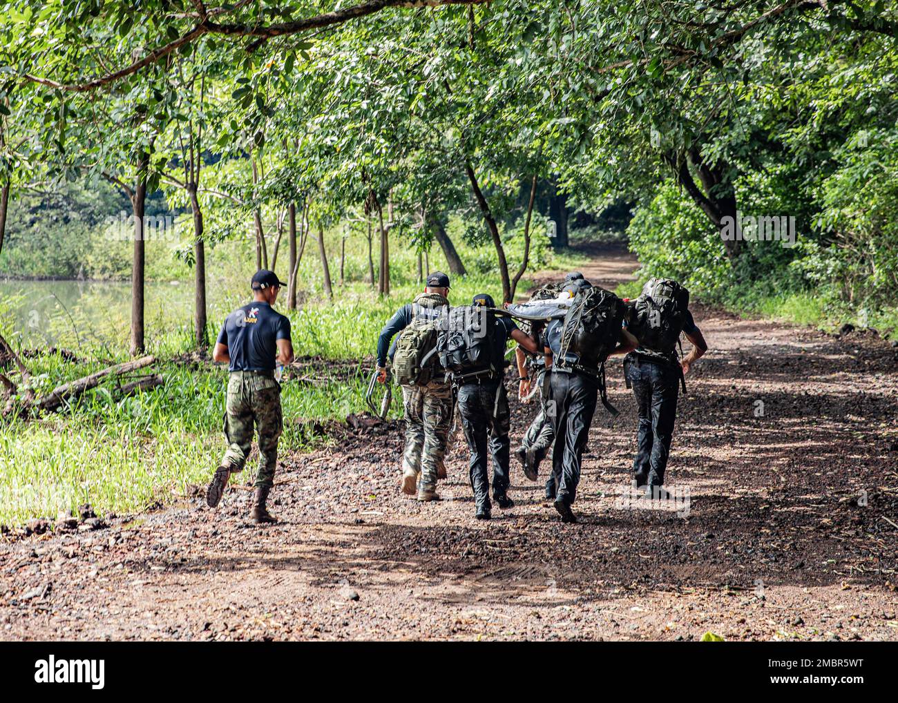 The Honduran team members carry a litter during the water and land ...