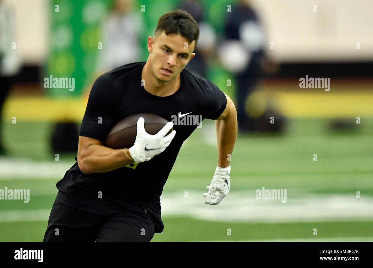 Former Oregon player and Olympian Devon Allen participates in a drill ...