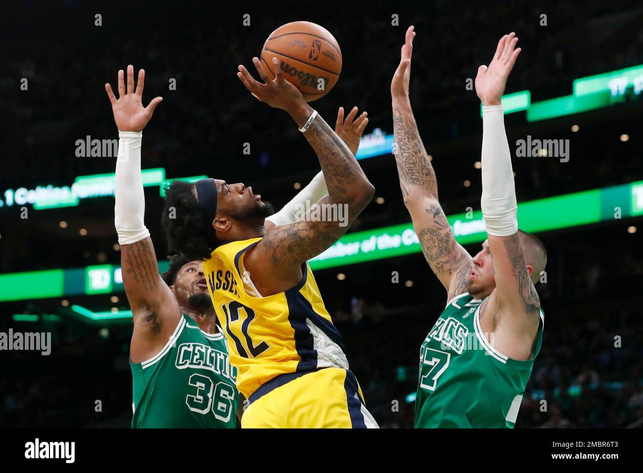 Indiana Pacers' Oshae Brissett (12) shoots against Boston Celtics ...