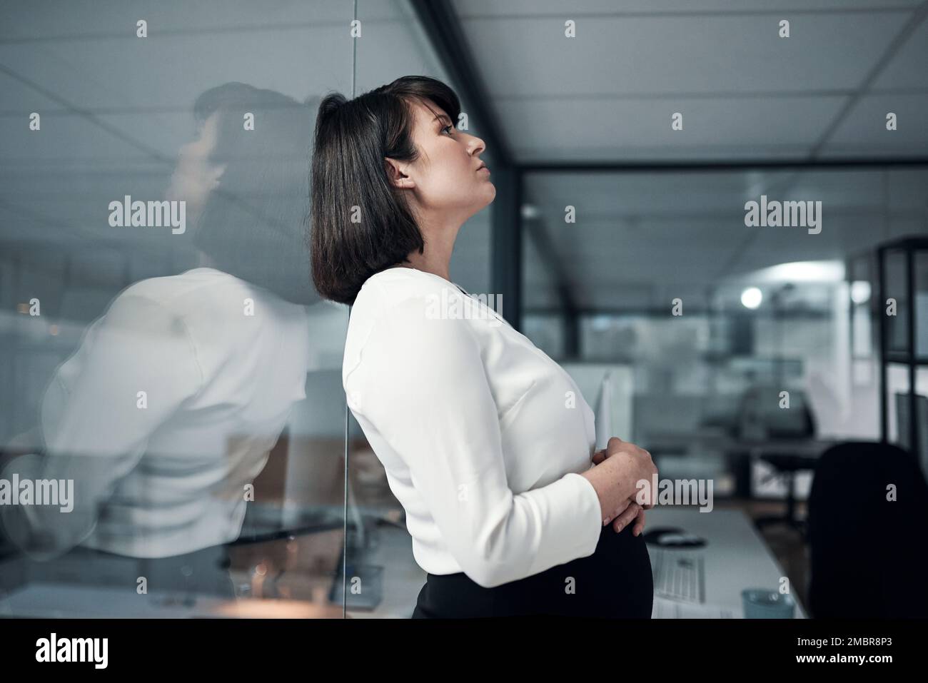 Im So Nervous To Become A Mom An Attractive Pregnant Businesswoman Standing Alone In The Office
