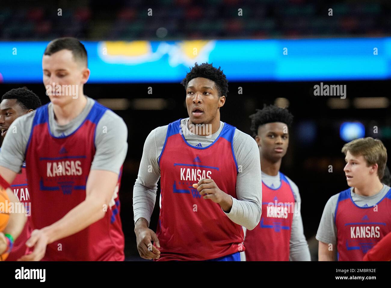 Kansas forward David McCormack, center warms up during practice for the ...