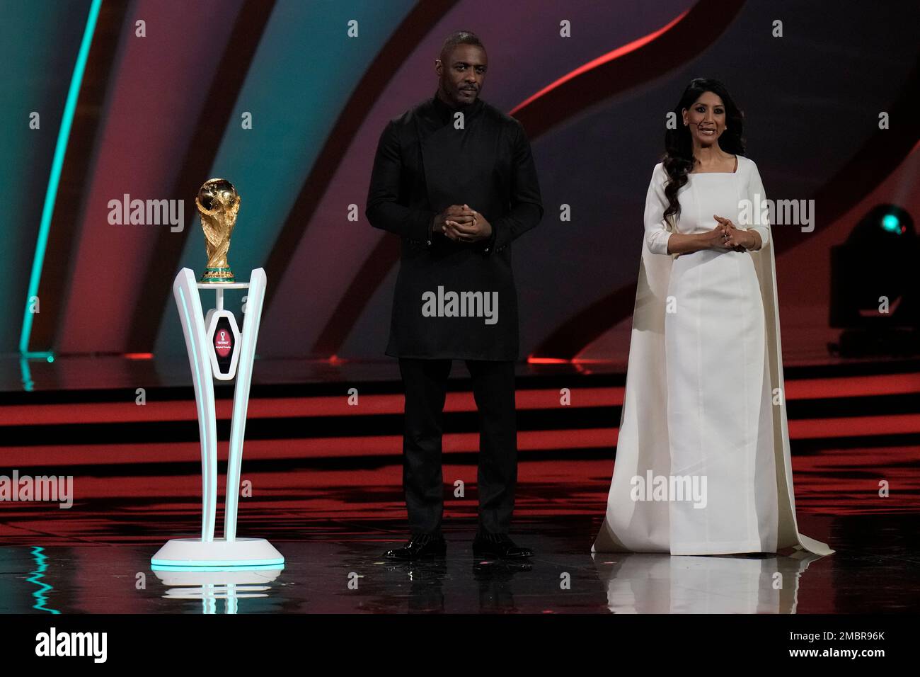 Actor Idris Elba nd sports broadcaster Reshmin Chowdhury stand on stage ...