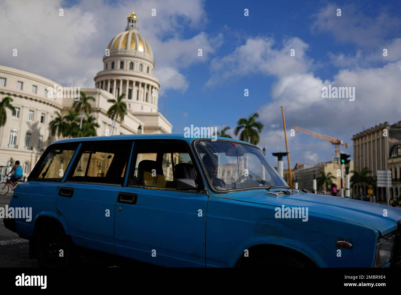 A driver navigates a vintage, Russian-made Lada station-wagon past the ...