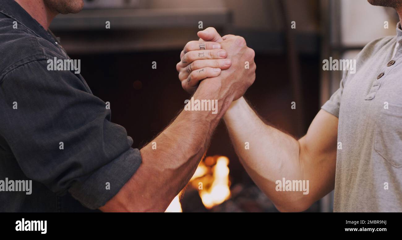 Two Muscle Men Handshake