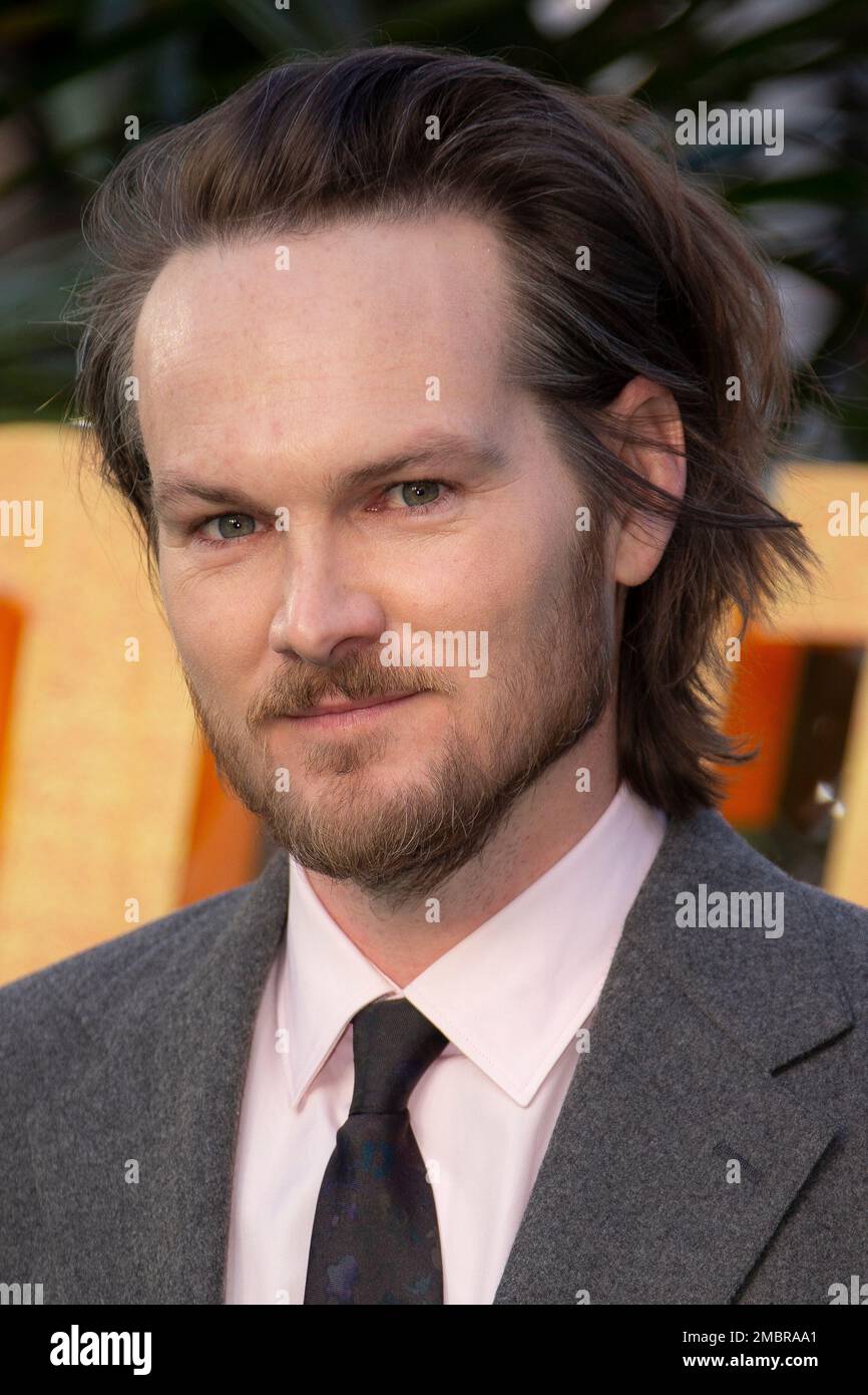 Director Adam Nee poses for photographers upon arrival at the premiere ...