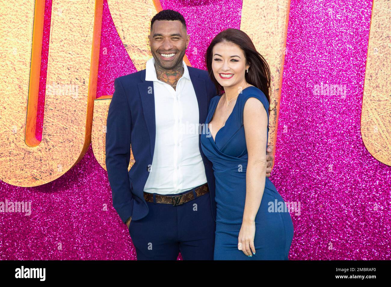 Jermaine Pennant and Jess Impiazzi pose for photographers upon arrival ...