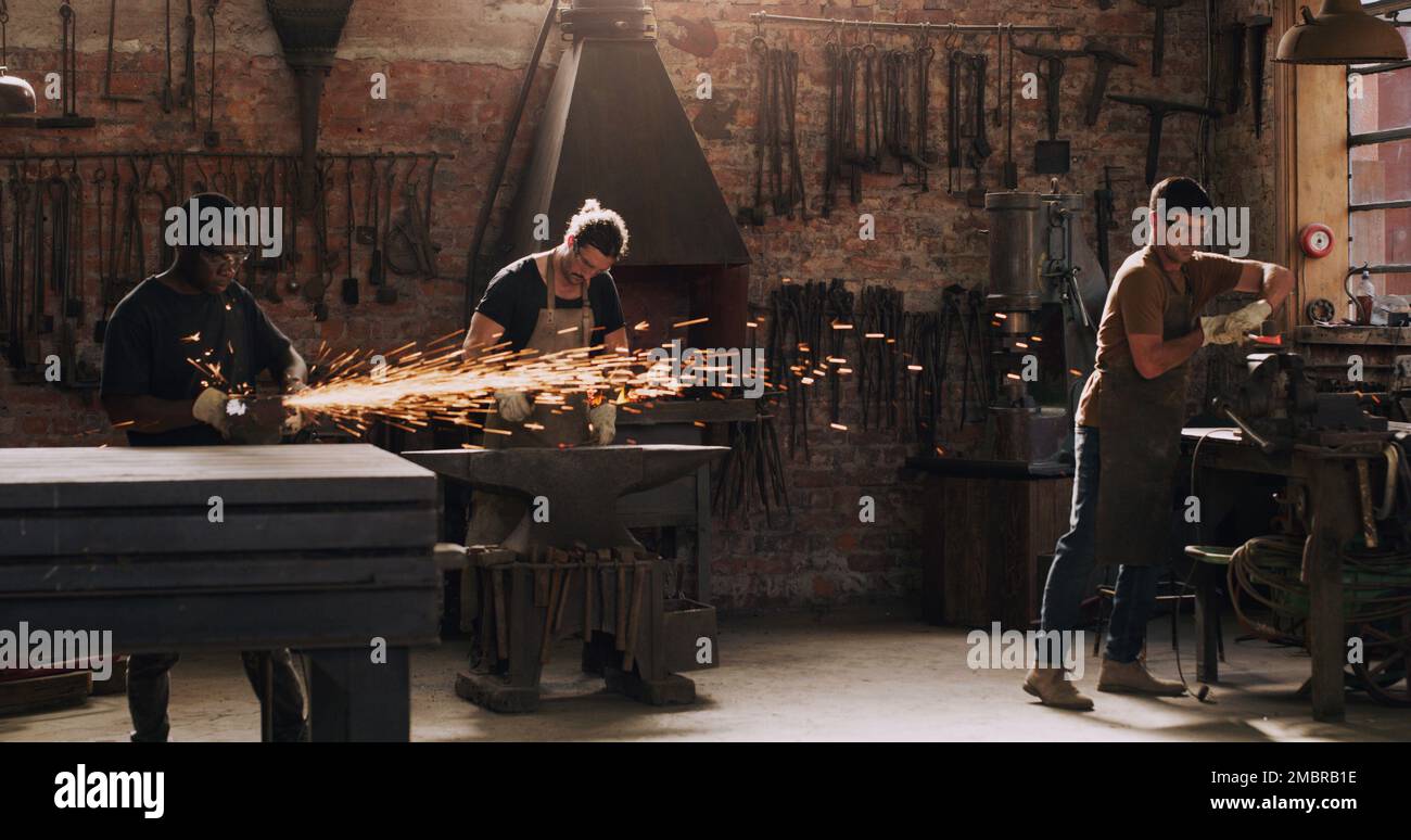 If you can dream it, we can do it. three metal workers working in a ...
