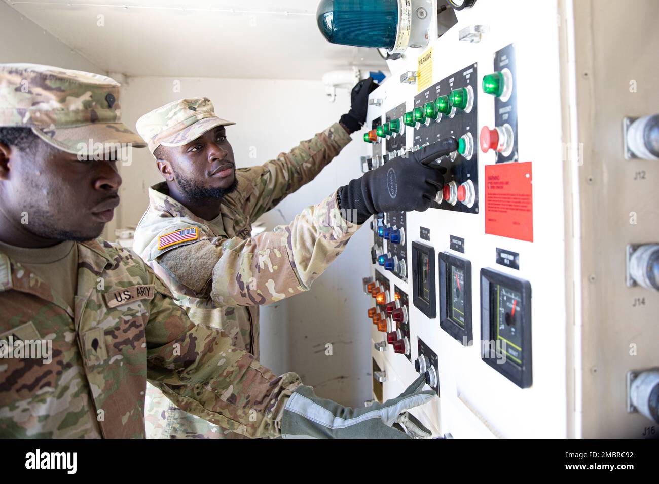 U.S. Army Reserve Spc. Muabrak Lamin (left) and Spc. Philip Arabambi ...