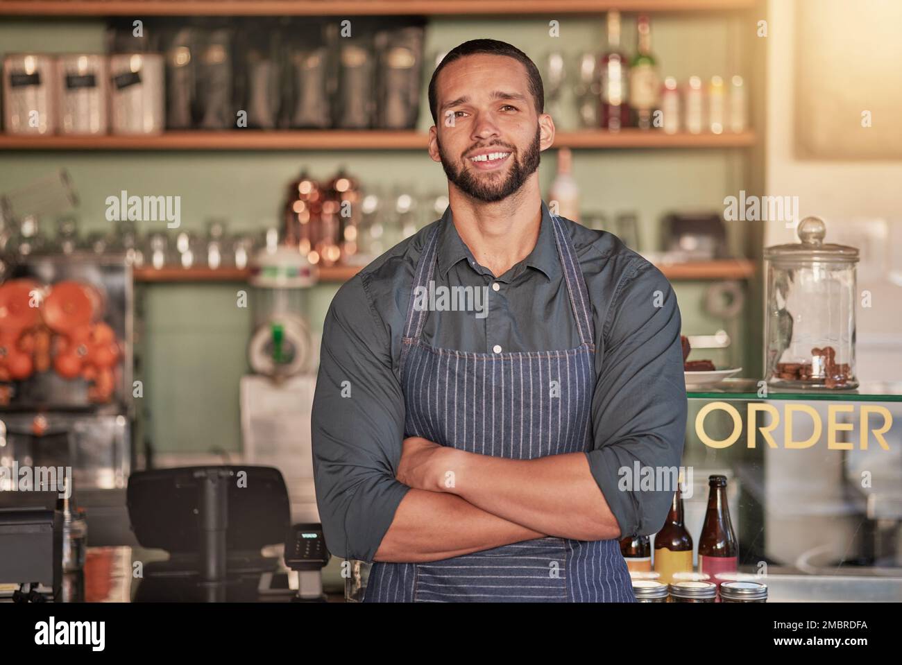 Portrait, cafe and barista man with arms crossed ready to take your ...