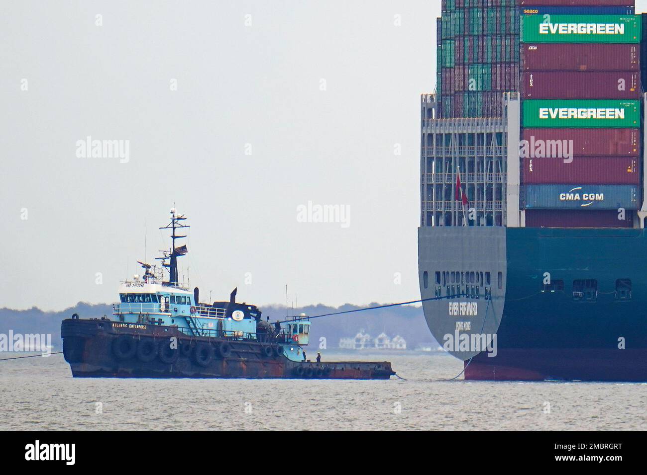 The tugboat Atlantic Enterprise, left, pulls the container ship Ever ...