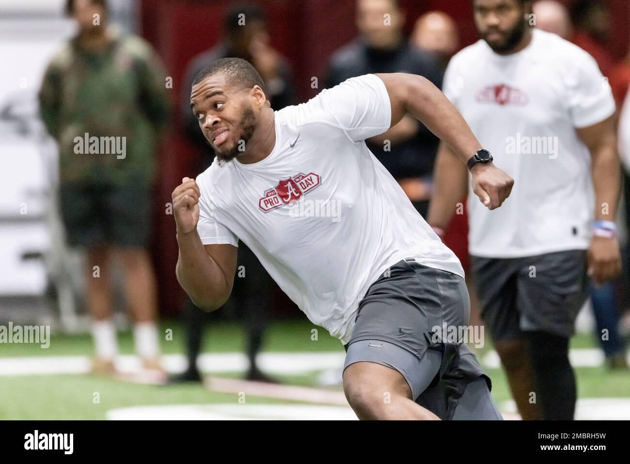 Former Alabama football player Evan Neal participates in position ...