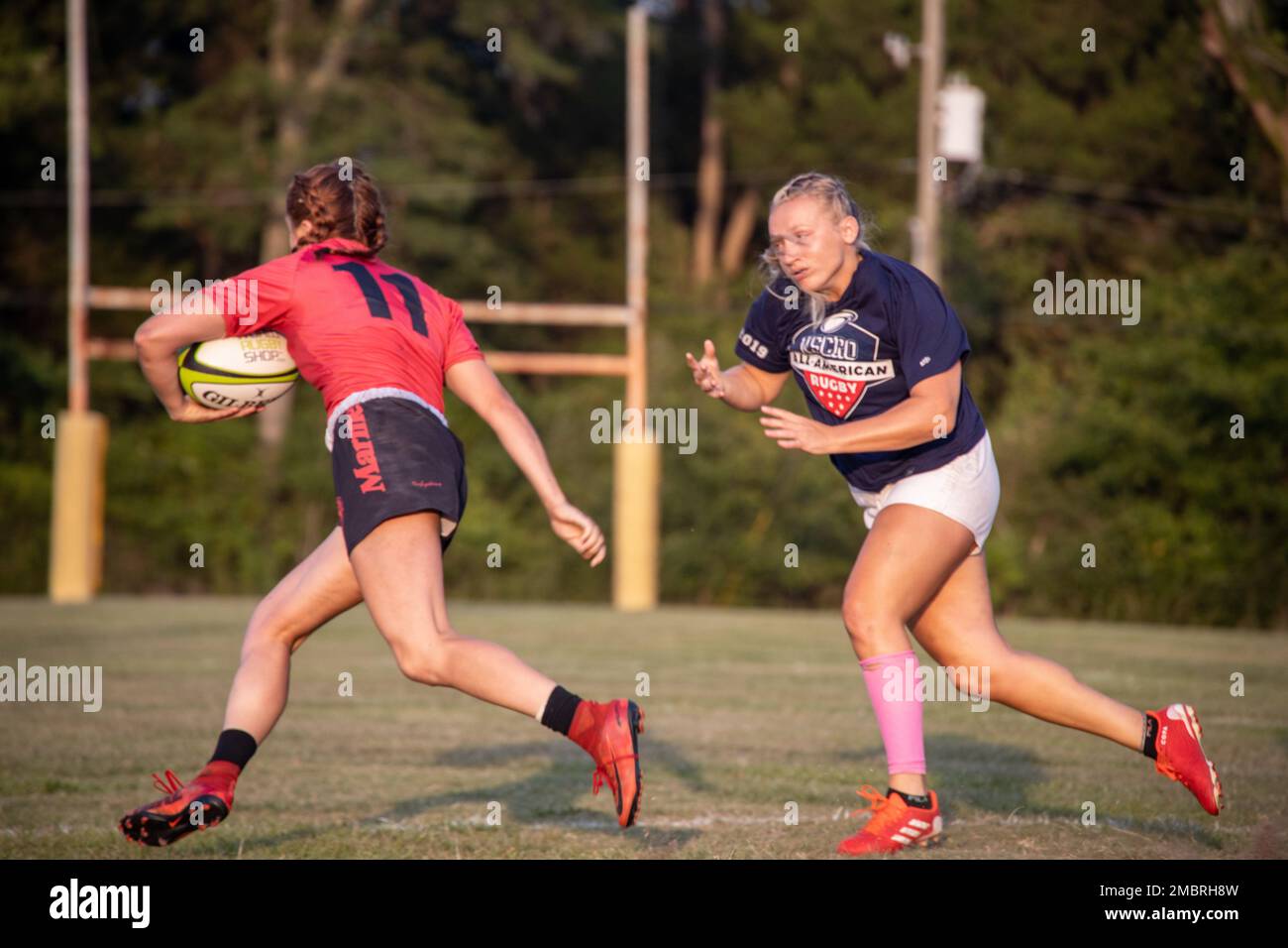 U.S. Marine Lance Cpl. Anastasia Schraff, left, USMC Rugby Team member ...
