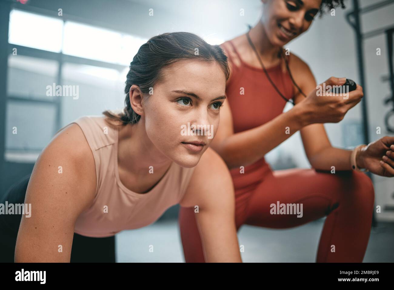 Fitness, gym client and personal trainer with time of health exercise ...