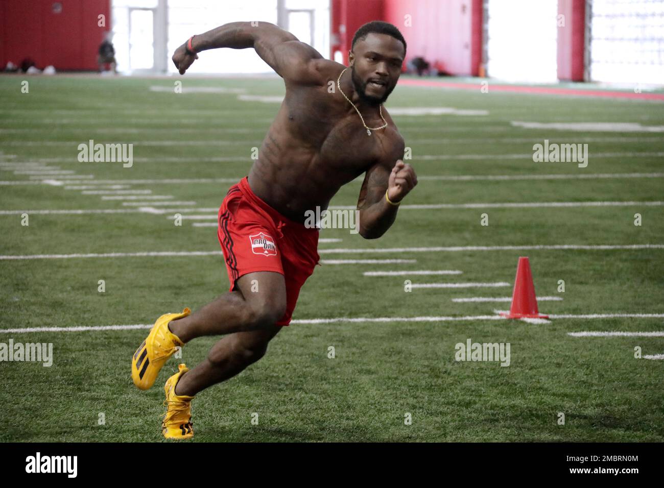 Running back Ricky Person runs a position drill for NFL scouts during ...